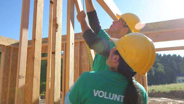 Volunteers working together on construction project - 4K Royalty-free ...