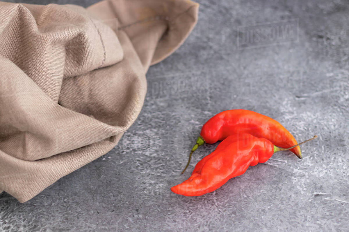 Presentation of Peruvian hot red chili (Aji Limo) - Stock Photo - Dissolve