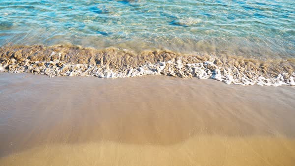 Foamy waters of ocean on summer resort on Cyprus in sunshine outdoors ...