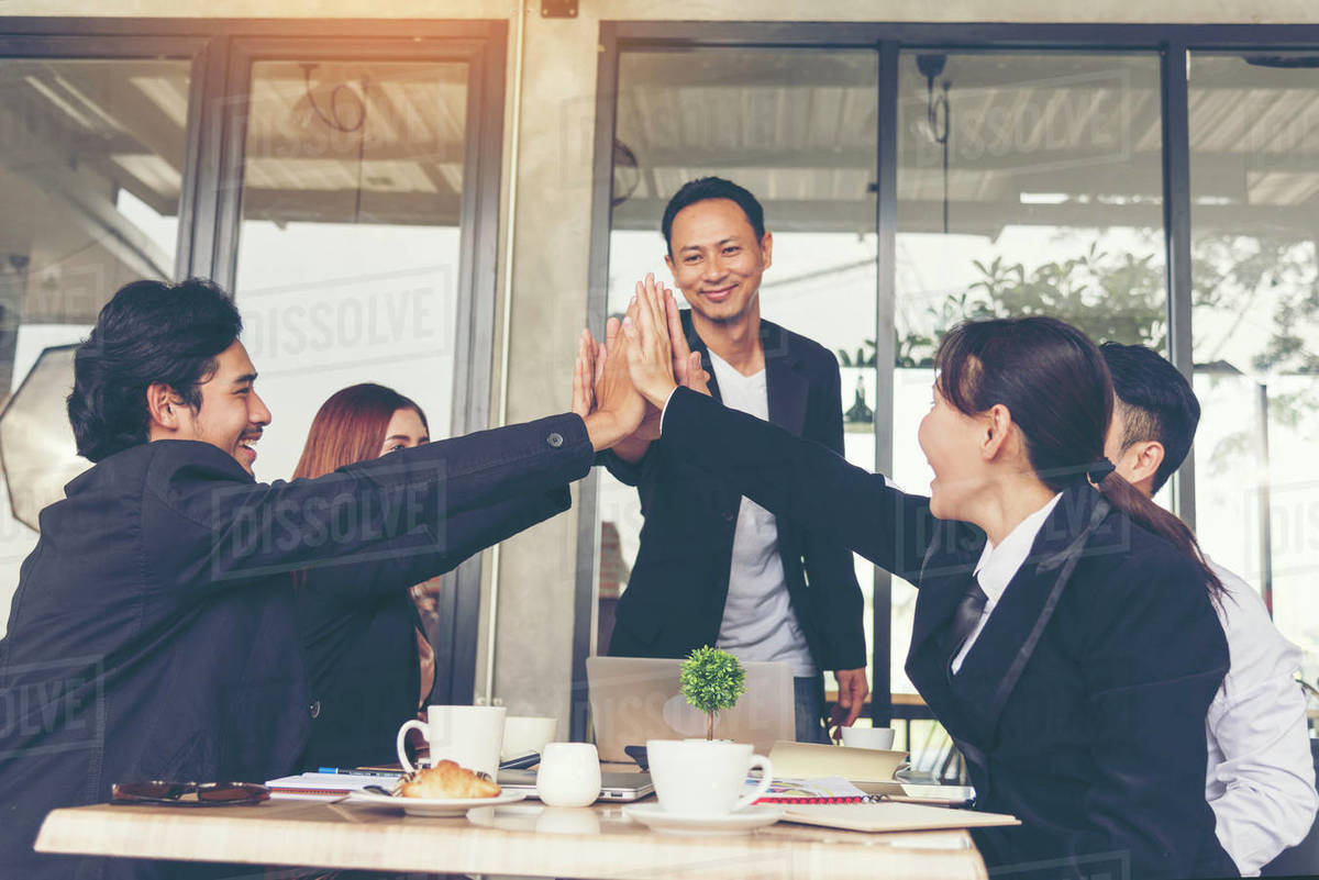 Teamwork Concept. Team meeting conference giving high five. Success ...
