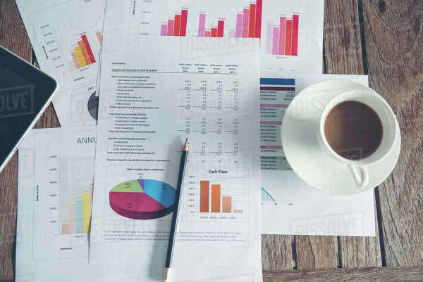 Office laptop business financial document chart and graph on wooden ...