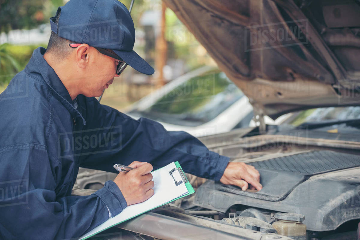 Mechanic car service auto garage in automotive mobile center. Technician workshop repair engine ...