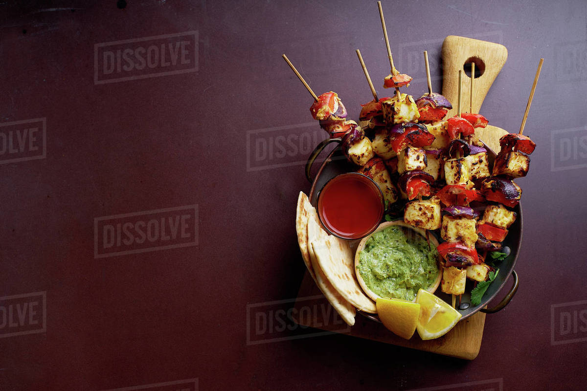 Paneer tikka starter kebabs with mint chutney and chapati. Traditional ...