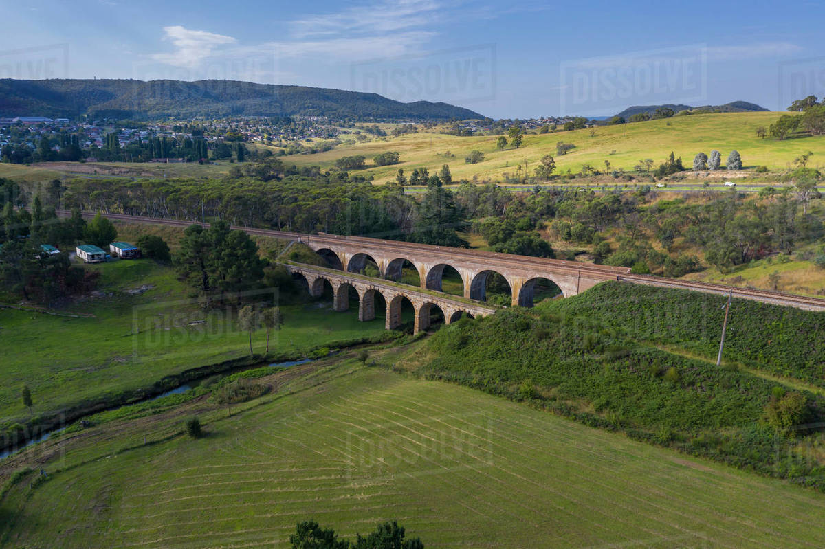 An old train viaduct in the countryside - Stock Photo - Dissolve