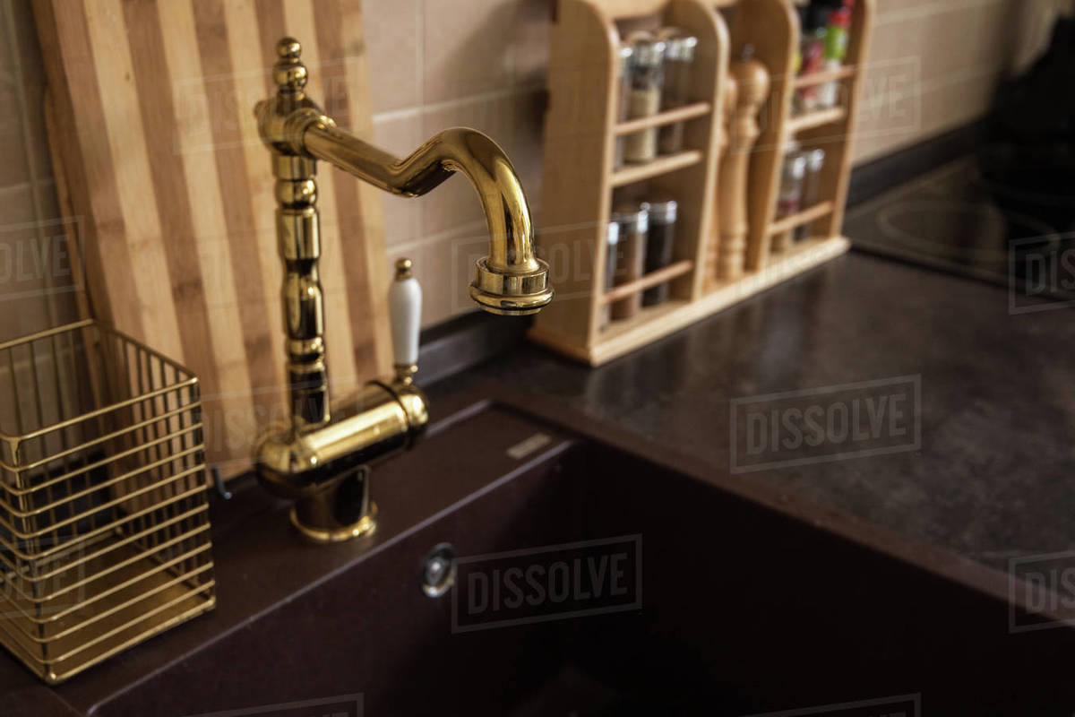 Photo of new modern kitchen interior. Luxury gold water tap - Royalty ...
