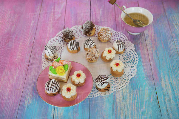 Different cakes composition on gradient background - Stock Photo - Dissolve