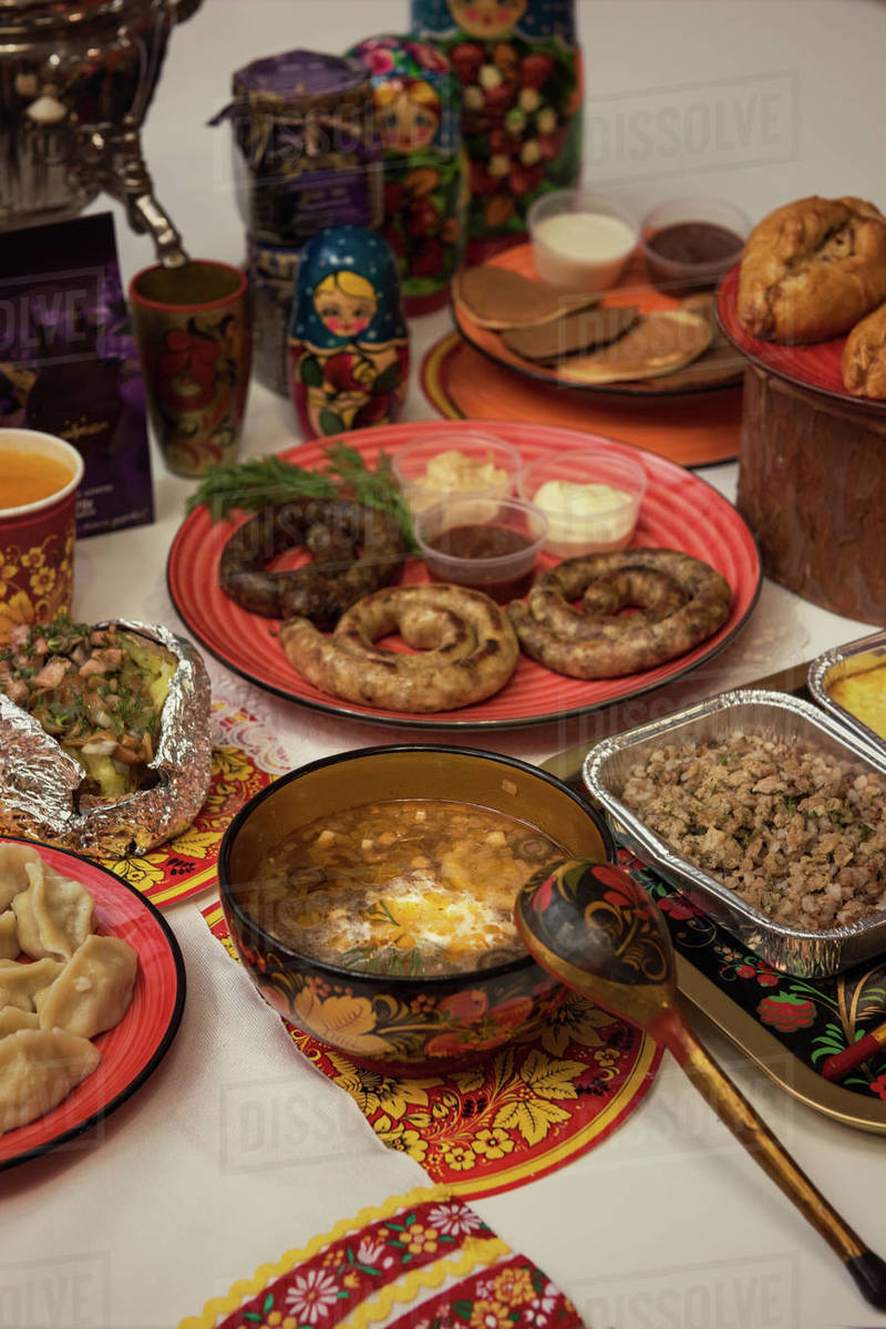 Table with traditional russian food decorated in russian style ...