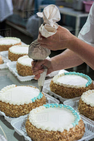 Manual cakes production on factory - Stock Photo - Dissolve
