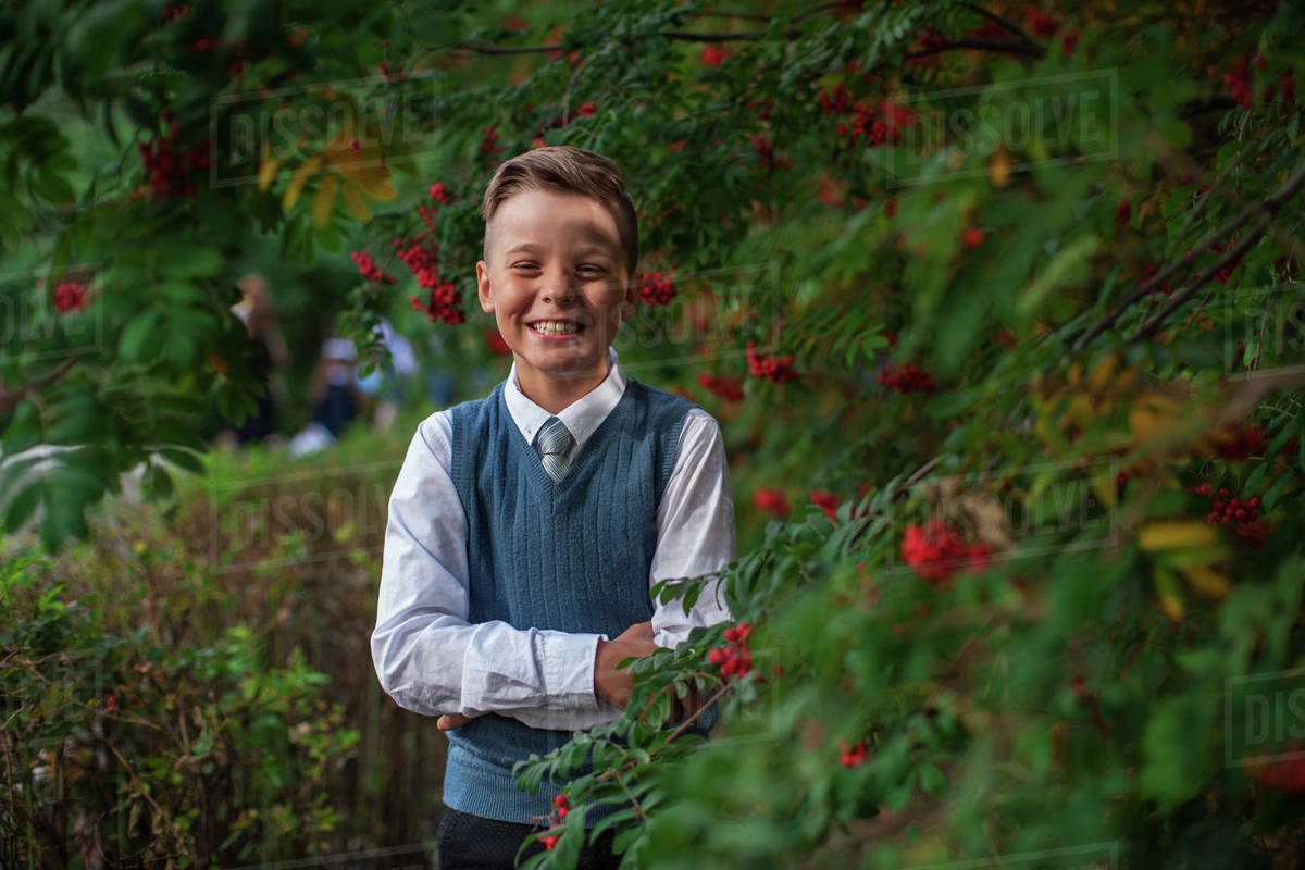 The first time in first class: happy schoolboy at school background ...