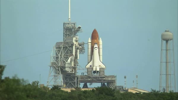 A wide telephoto shot of STS 120 - Space Shuttle Discovery on launch ...