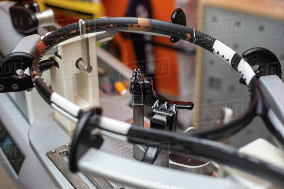 Process of stringing a tennis racket in tennis shop, sport and leisure ...