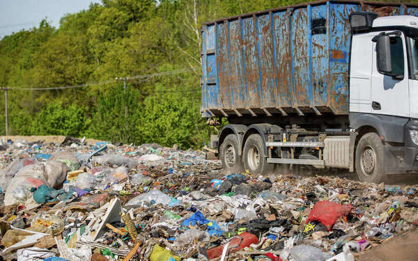 Truck delivering garbage and waste from household to landfill, ecology ...
