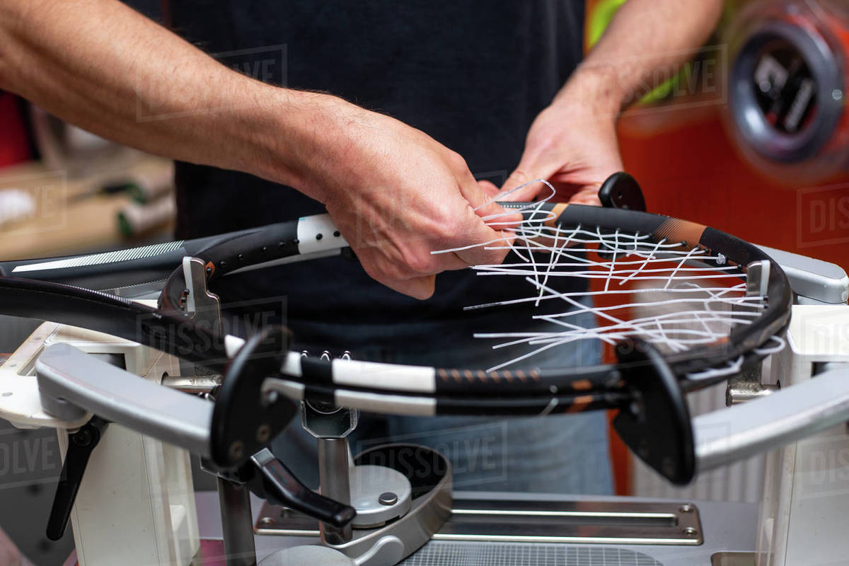 Process of stringing a tennis racket in tennis shop, sport and leisure ...