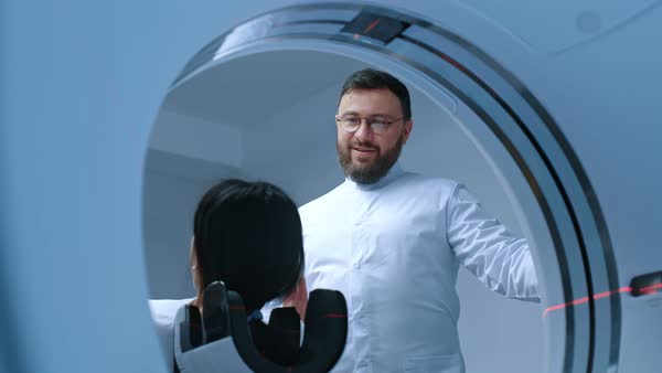 Oncology diagnostic room, radiologist observes MRI, CT or PET scan of ...