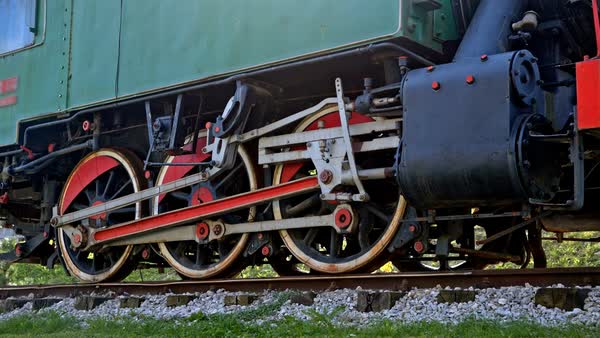 Retro steam locomotive big wheels on train rails. Dolly sliding low ...