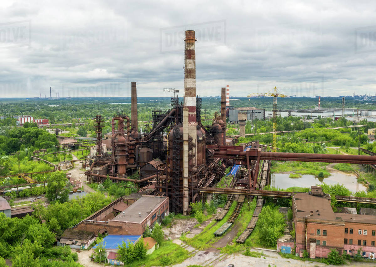 Aerial photo of an old abandoned steel plant in the natural landscape ...