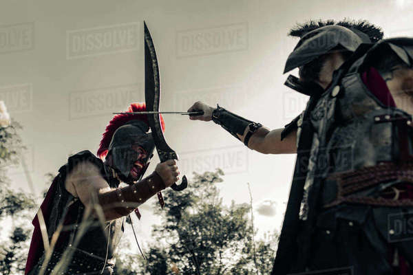 Battle with swords between two ancient greek or roman warriors in ...