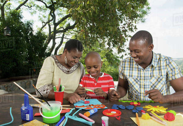 Family doing crafts - Royalty-free Stock Photo | Dissolve