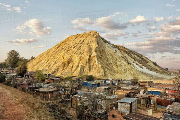 Shacks built in a mine dump, Johannesburg - Stock Photo - Dissolve