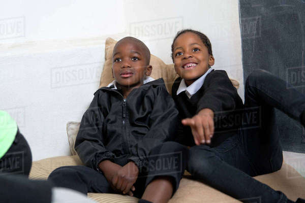 Portrait of two young kids smiling - Stock Photo - Dissolve