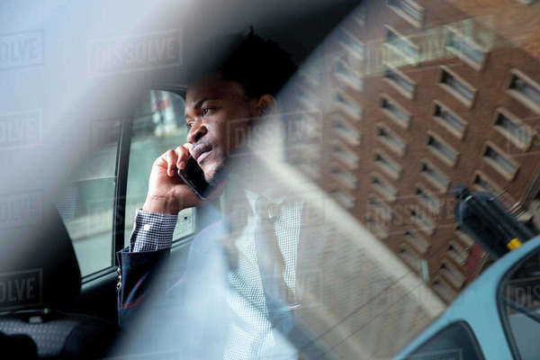 Business man seen through car window - Stock Photo - Dissolve