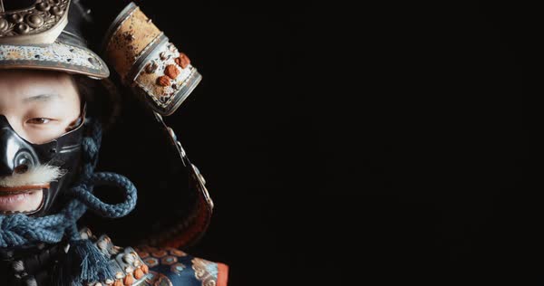 Japanese man in traditional samurai armor and authentic helmet looking ...