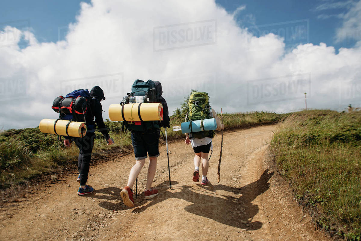 group of people on hiking go with backpacks in the mountains - Royalty ...