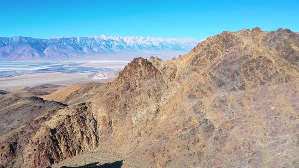 Aerial of the vast Owens Valley region reveals the Eastern Sierras of ...