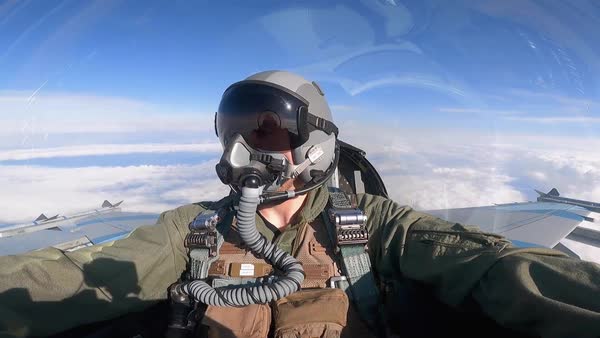 2021 Cockpit view of a reporter in the jump seat of a jet fighter plane ...