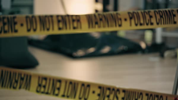 Dead victim in body bag lying on floor, trashed crime scene with ...