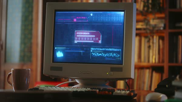 System breach process ending on screen of old desktop computer, cyber ...