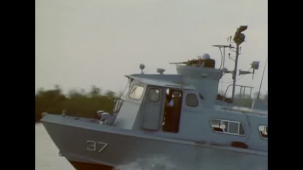 1967 - Navy river patrol boats fire towards the shore during the ...