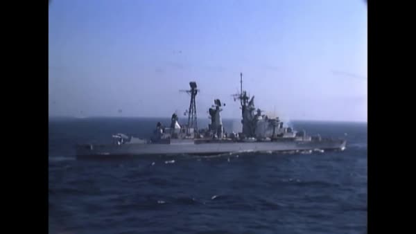 Explosions are shown and guns are fired from United States Navy ...