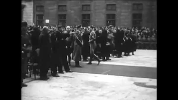 1940s-- Rudolf Hess stands Adolph Hitler and salutes, and a group of ...