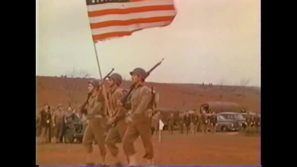 Soldiers march and drive armored vehicles in a parade for FDR in North ...