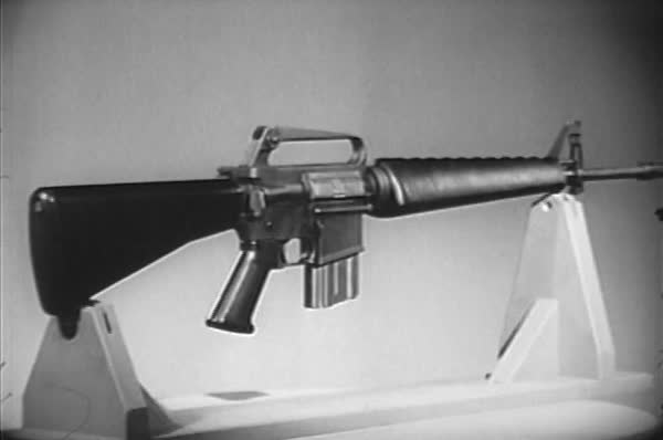 A US Army soldier demonstrates how to load the M16 rifle in an ...