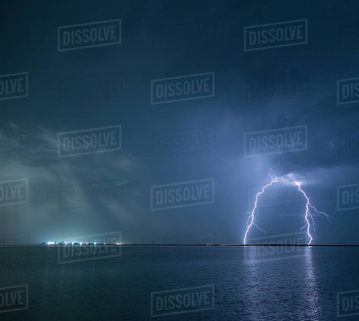 Lightning over water. Electric discharge. Nature background for design ...