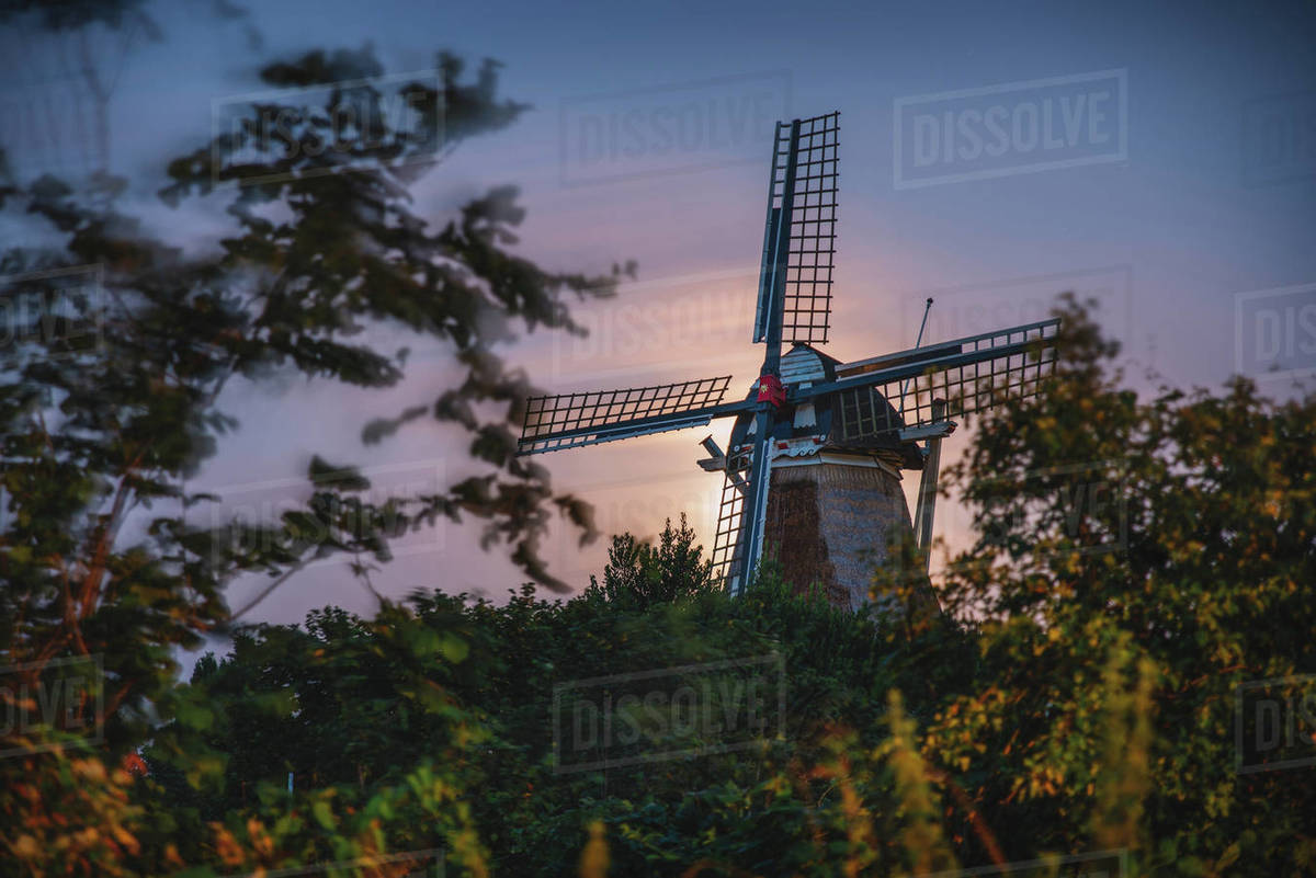 Old Dutch windmill in the evening - Royalty-free Stock Photo | Dissolve