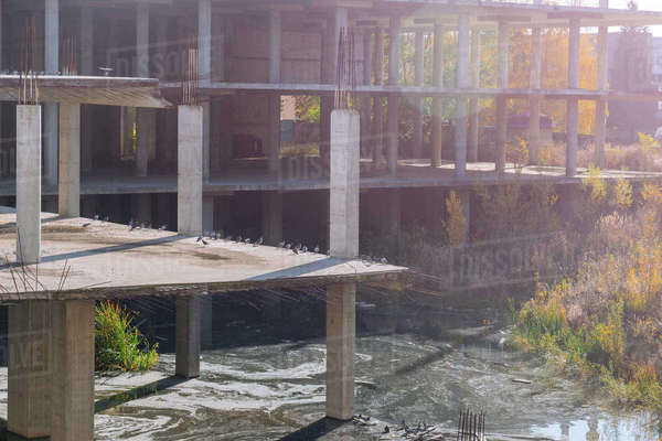 Construction site with flooded foundations and piles after a hurricane ...