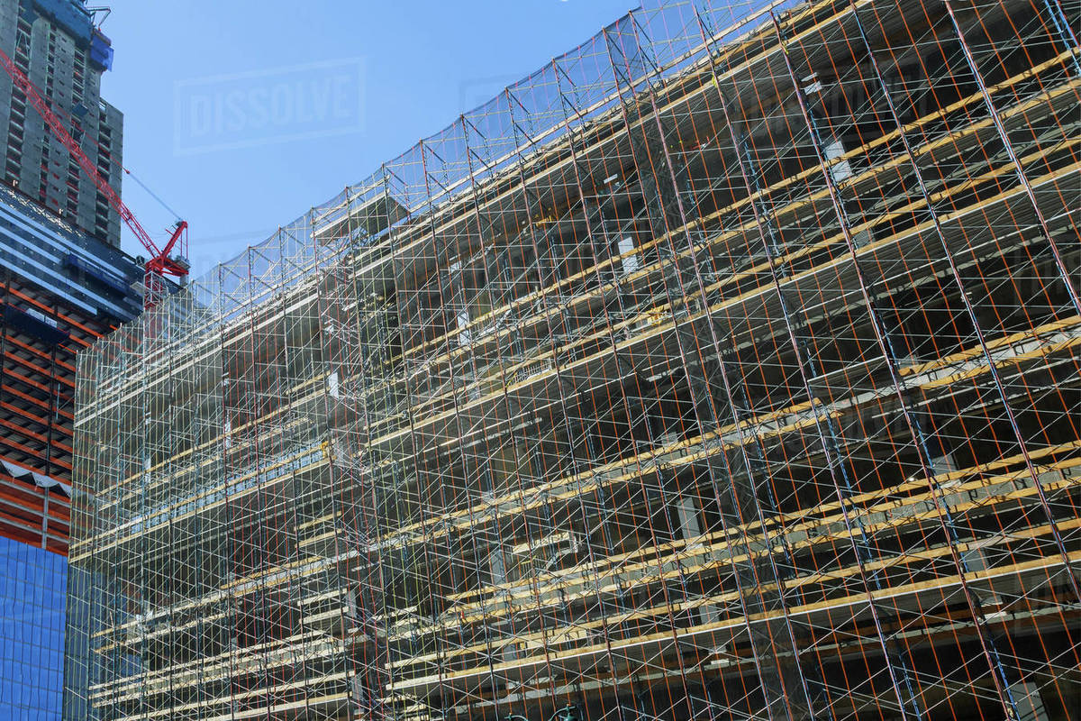 Facade of new commercial property skyscraper construction process for ...