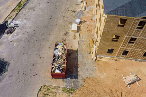 Aerial view of apartment framing of a new house under stacker wooden ...