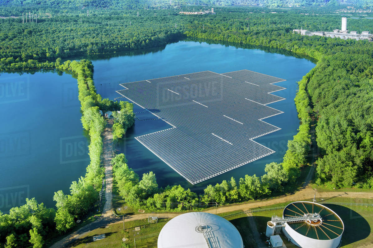 Aerial view of floating platform of solar panels on a beautiful lake ...