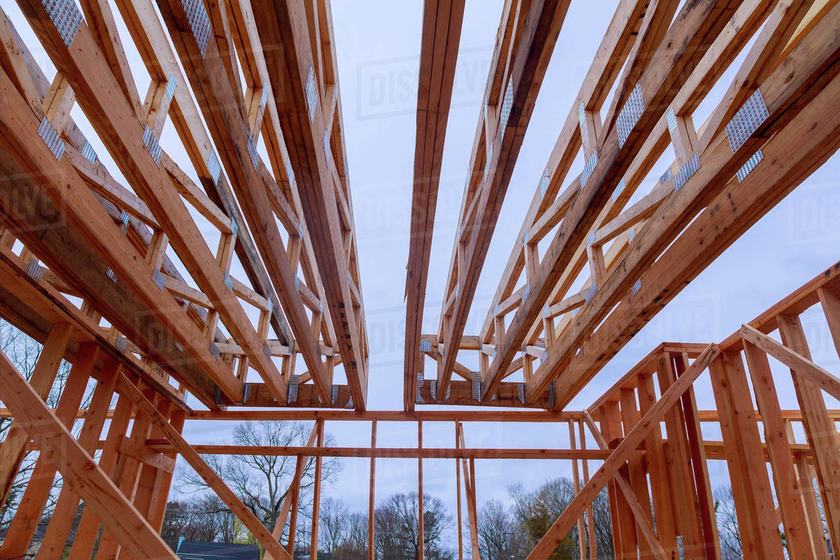 Framing of under construction wooden house building frame structure on ...