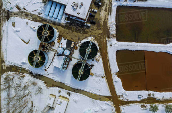 View of sewage treatment plant in winter season with sewage farm ...