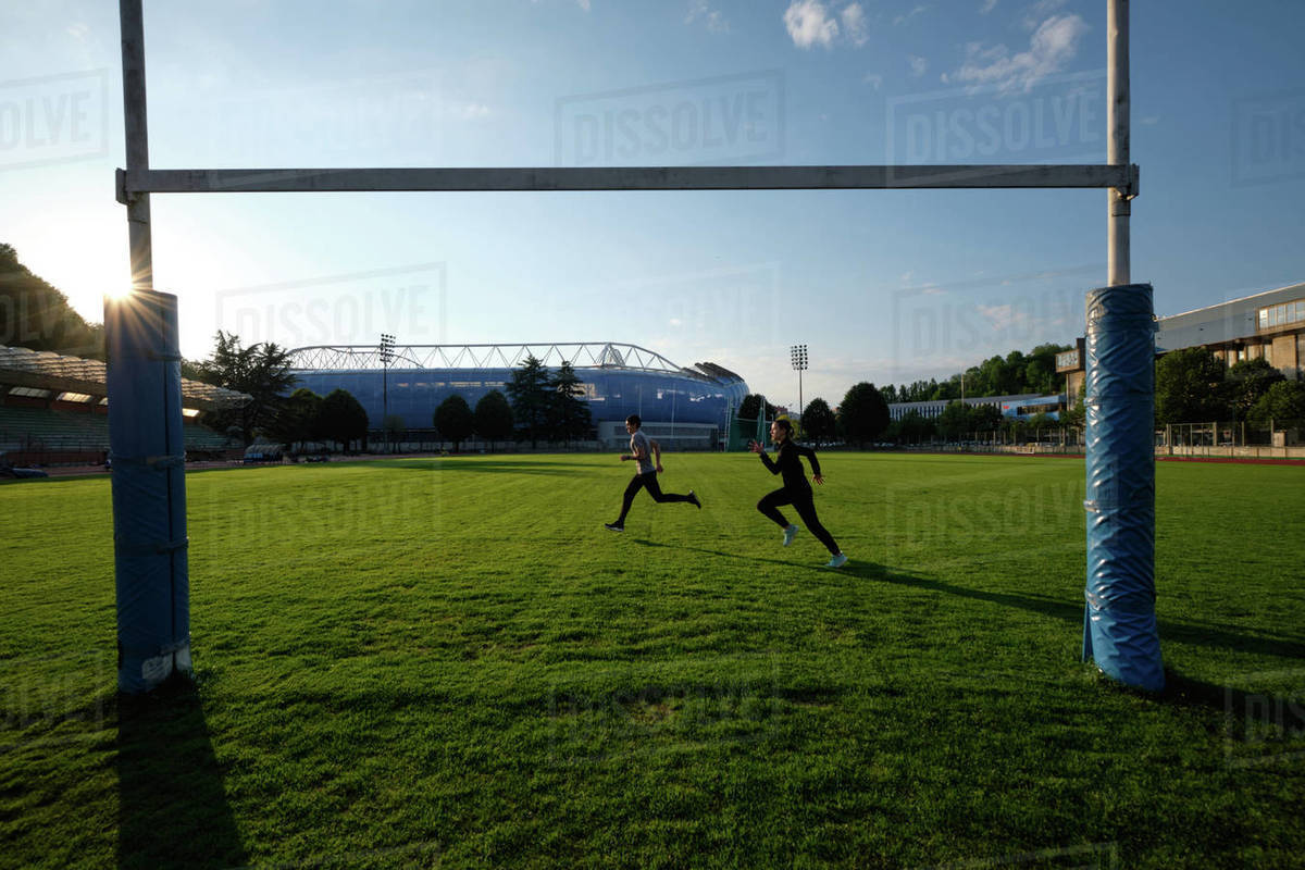 two young adult athletes competing against each other to win a friendly ...