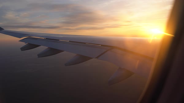 Airplane flight. Flying above the clouds. View from the plane window ...