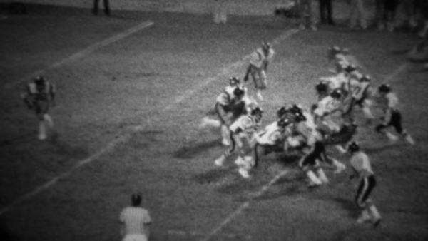 1978: High school football night game quarterback keeps ball. San ...