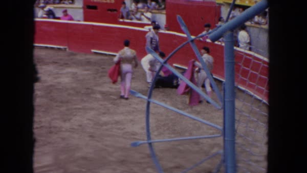 1962: a bull ring after a violent bull fight with matadors and a dying ...