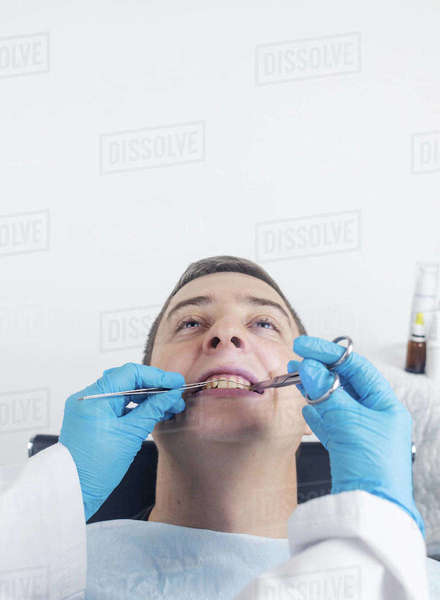 Installation of braces, bridges and a dental plate to correct teeth. An ...