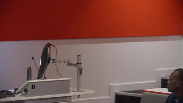 Teacher at lectern and students in lecture theatre, close up - Stock ...